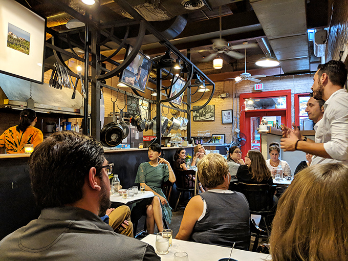 Where strangers become friends over shared meals. The bustling caf&eacute; atmosphere captures that magical communal dining experience that's becoming increasingly rare.