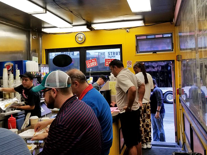 The line forms with purpose&mdash;locals and visitors united in the universal language of "I need that cheesesteak right now."