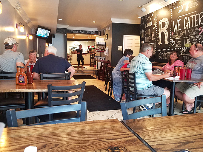 Where BBQ brings strangers together as temporary friends. The universal language of "pass the sauce" transcends all differences at these wooden tables.