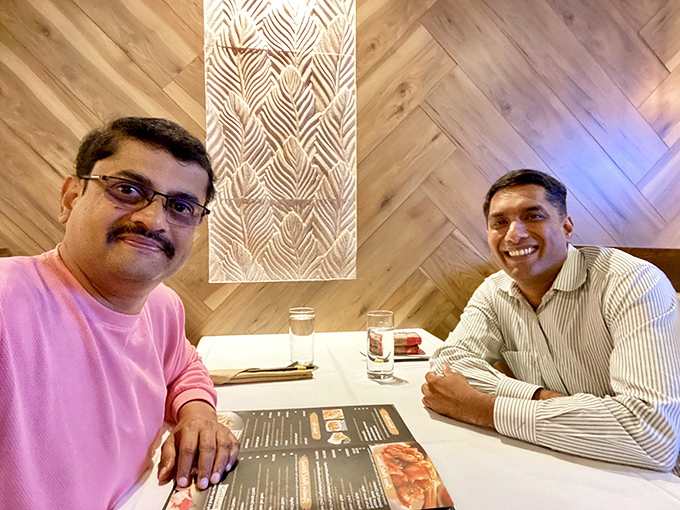 The dining room&mdash;where strangers become friends over shared plates and the universal language of "you've got to try this."