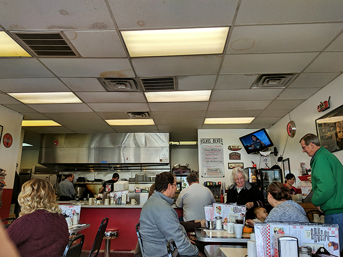 Morning rituals unfold at tables and booths, where newspapers are still read and breakfast decisions are contemplated with appropriate seriousness.