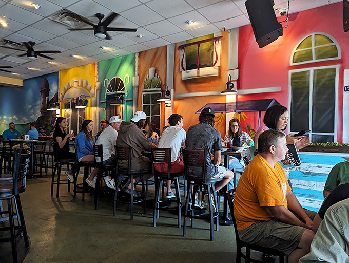 The diverse crowd at Food Shack proves great food brings everyone together. Flip-flops and business casual coexist in culinary harmony.