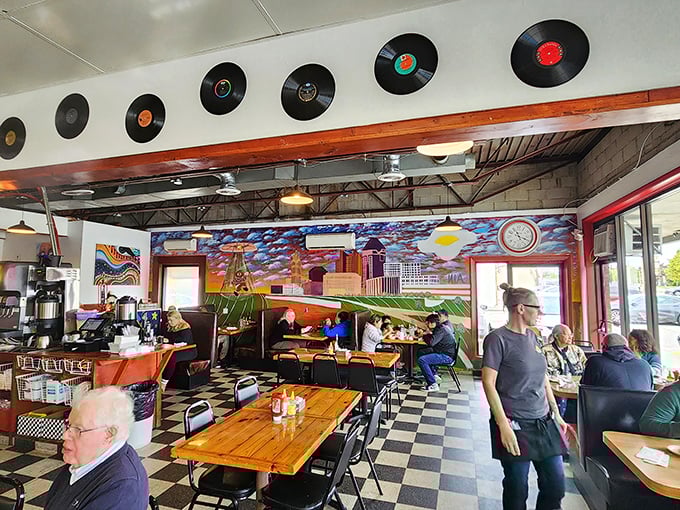 Where locals gather to solve the world's problems over eggs and coffee, beneath a mural that captures Columbus's colorful spirit.