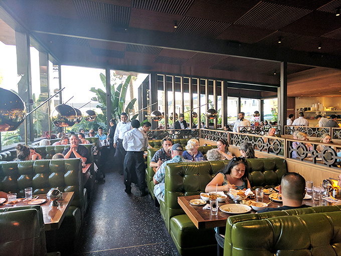 A bustling dining room where conversations flow as freely as the wine&mdash;these green booths have heard decades of first dates and family celebrations.