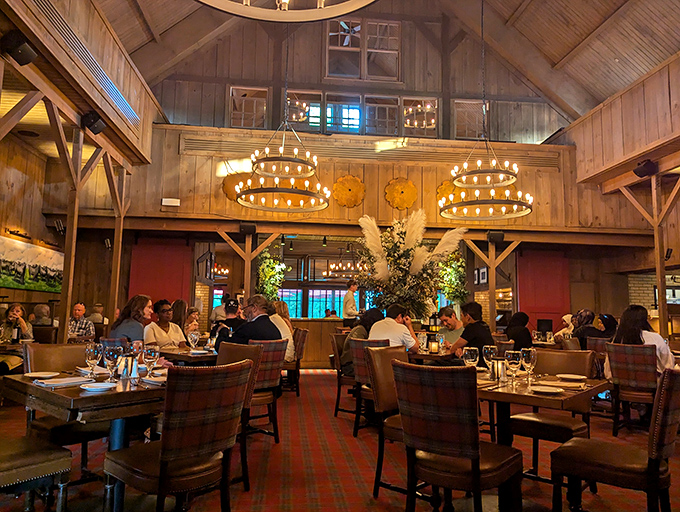 The cathedral-like wooden ceiling watches over diners like a benevolent spirit, silently blessing every bite with its warm, rustic glow.