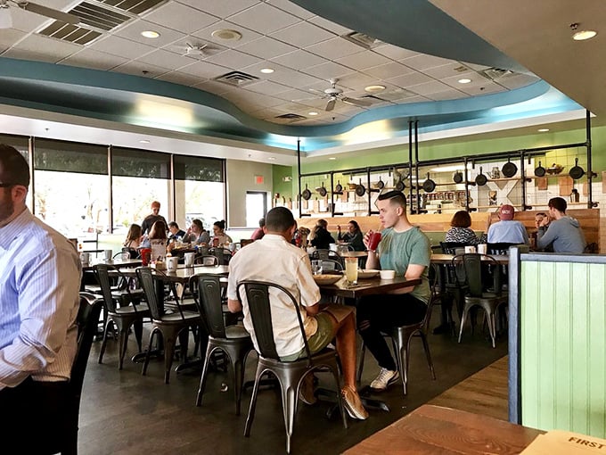 A bustling dining room where strangers become temporary neighbors, united by the universal language of "pass the syrup, please."