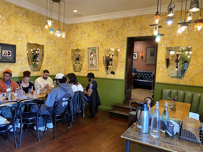 Yellow wallpaper that would make Charlotte Perkins Gilman jealous, paired with eclectic lighting that says, "Yes, we're hip, but we're not trying too hard."