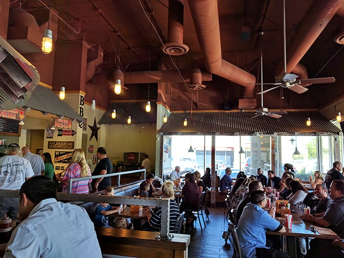 A packed house of BBQ devotees engaged in that sacred ritual of silent appreciation punctuated by occasional groans of delight.