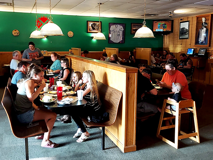 Families gathered around tables, sharing slices and conversation&mdash;the universal language of "this pizza is too good to talk about until we finish eating."