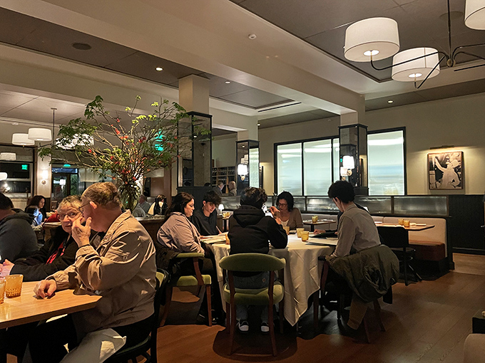 The dining room hums with that perfect blend of energy and intimacy &ndash; where strangers' laughter becomes part of your own dining soundtrack.