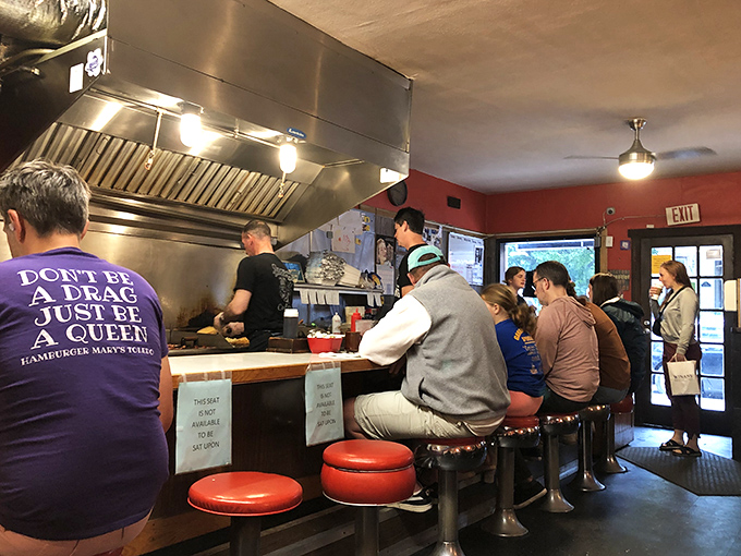 Counter seating: where solo diners become part of the restaurant's rhythm and regulars hold court like neighborhood royalty.