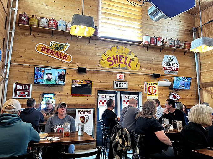 Where locals gather to share stories and meals, beneath the watchful gaze of classic farm and automotive memorabilia.