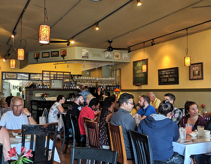 A bustling dining room filled with happy eaters&mdash;the universal language of good food bringing strangers together under one delicious roof.