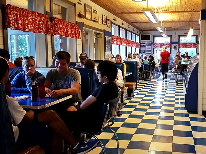 Generations gather around blue tables, creating memories one bite at a time. Some conversations can only happen over pie.