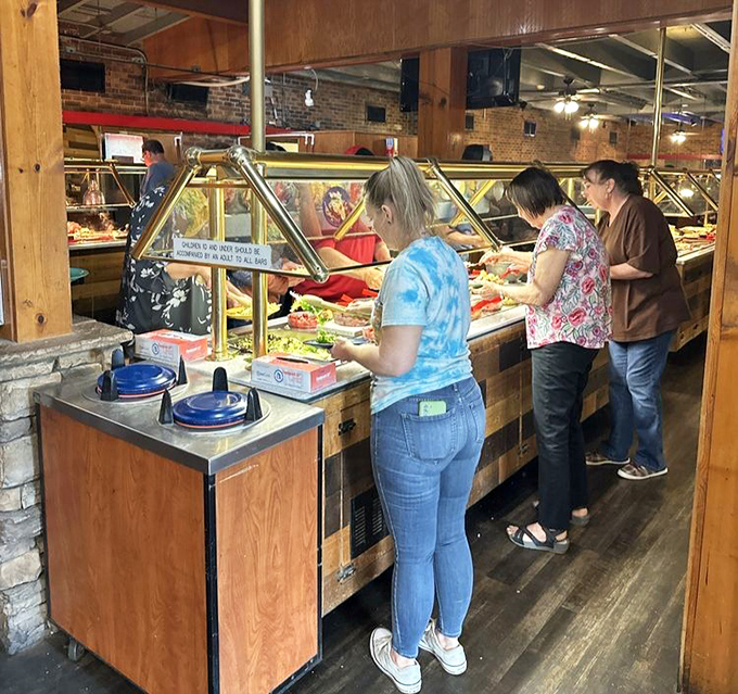 The buffet pilgrimage in progress. Notice the focused expressions&mdash;this isn't their first rodeo at Austin's legendary spread.