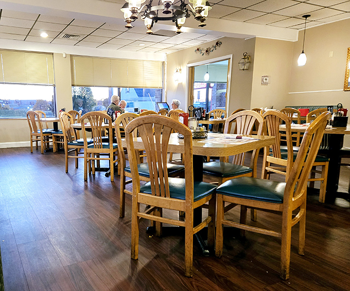 Wooden chairs and warm lighting create that "everybody knows your name" feeling. The diner's dining room&mdash;where strangers become regulars.