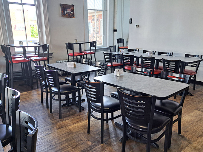 Clean lines, classic diner furniture, and the promise of good food. This dining area has hosted more meaningful conversations than most therapists' offices.