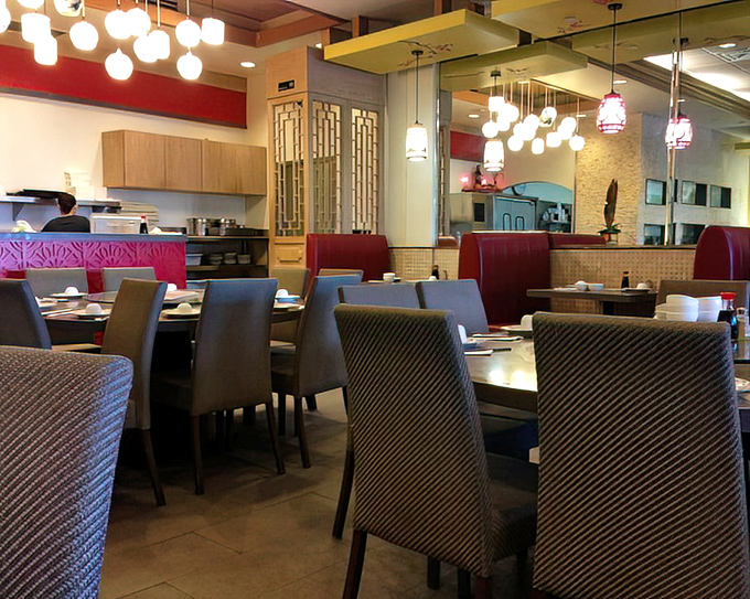 Modern meets traditional in this dining space where family-style tables await multi-generational feasts and inevitable food envy.