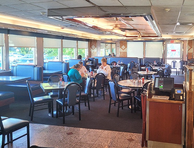 The dining room hums with the symphony of forks against plates and coffee cups meeting saucers—diner music at its finest.