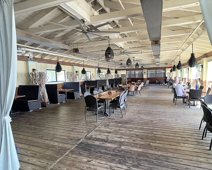 Spacious dining with rustic wooden floors that have witnessed countless "mmms" and "you've got to try this." Every table has a story. 