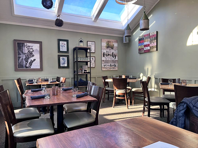 Skylights flood this dining area with natural illumination, while inspirational signs remind us why breaking bread together matters.