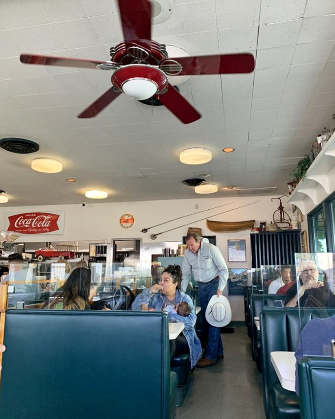 Green booths, ceiling fans, and conversations that flow as freely as the coffee—the dining room is diner perfection.