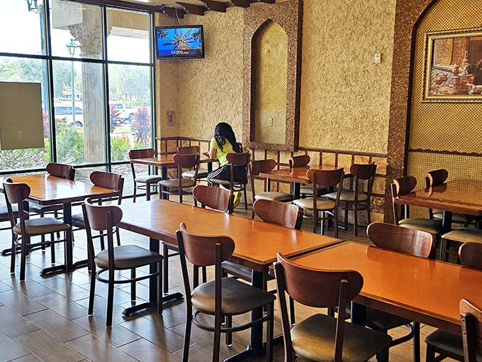 The textured walls and wooden accents create a dining space that feels worlds away from Orlando's theme parks, yet remains comfortably familiar.