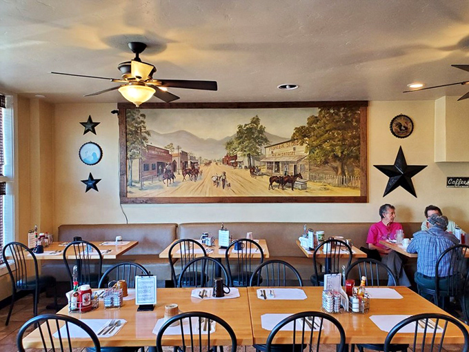 The western-themed dining area, complete with a mural of old Ramona, sets a scene that's part nostalgia, part comfort, and entirely welcoming.