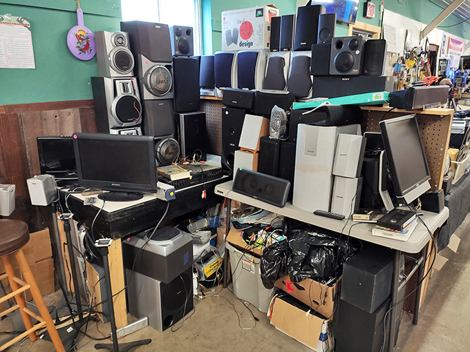 The electronics corner resembles a museum of technological evolution. Those speakers have probably blasted everything from disco to grunge. 