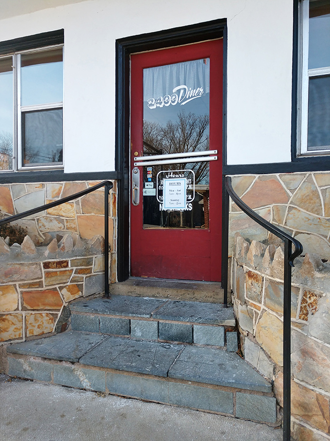 The red door entrance says it all—you're not just walking into a diner, you're stepping into a Fredericksburg institution where breakfast dreams come true.