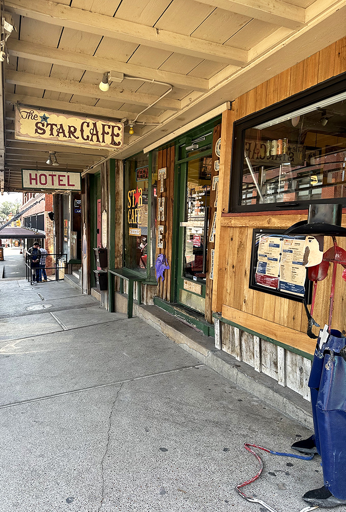 The weathered wooden entrance tells stories before you even step inside, with vintage signage hinting at the authentic experience waiting beyond those doors.
