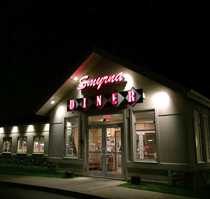 After dark, the Smyrna Diner sign glows like a beacon for night owls and early risers alike. Comfort food doesn't check its watch.