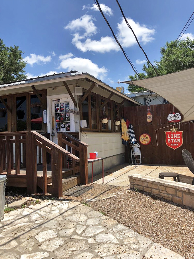 The entrance beckons with promises of Texas beer signs and homestyle cooking. No fancy facade needed when the food speaks volumes.