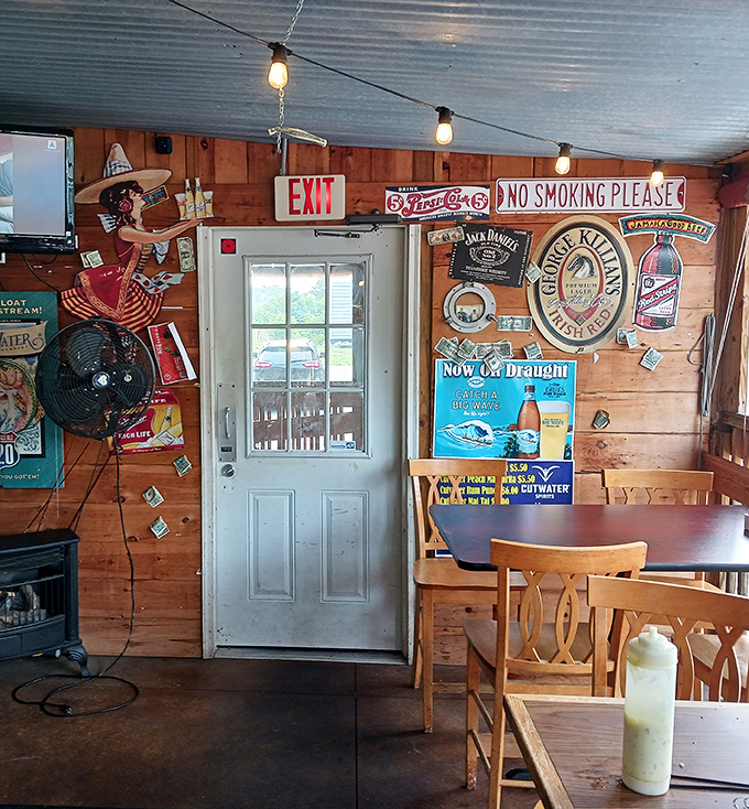 Wooden walls adorned with vintage beer signs and fishing memorabilia create the perfect backdrop for stories shared over plates of freshly fried seafood.