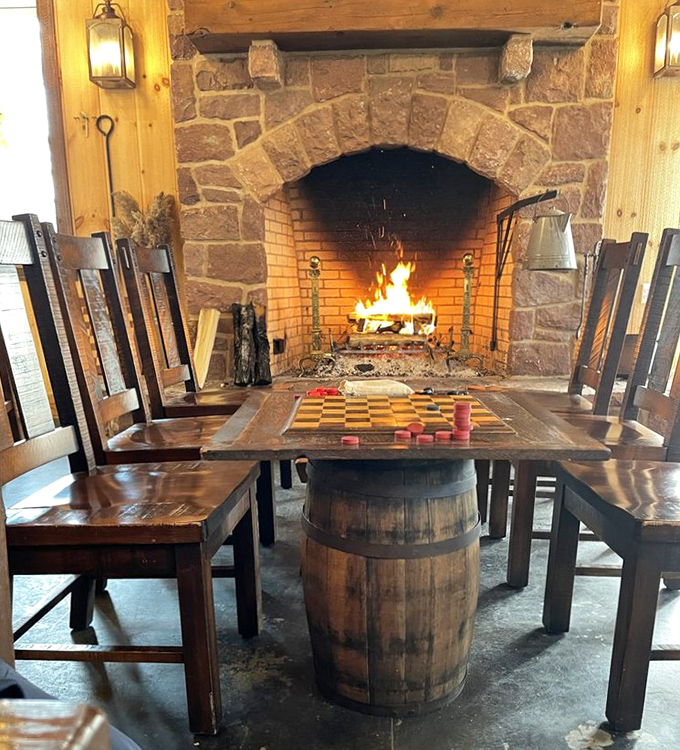 That fireplace isn't just for show &ndash; it's warming souls and checkerboard battles alike. Comfort food deserves a comfortable setting.