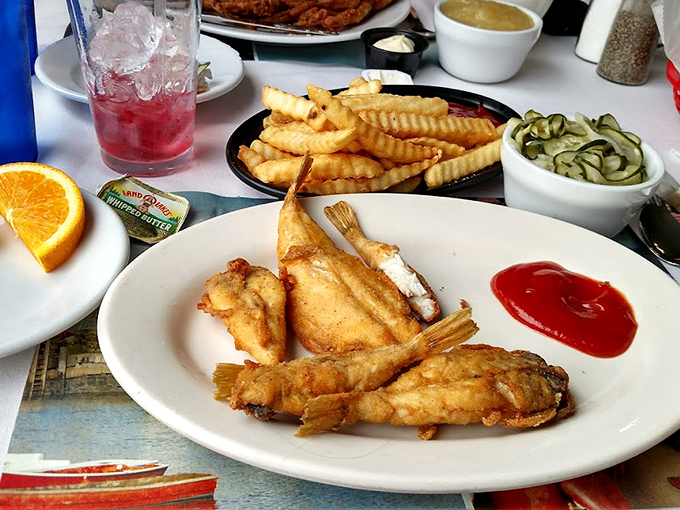 Fish and chips that would make the British jealous, with a side of crinkle-cut fries that achieve the perfect crisp-to-fluffy ratio.