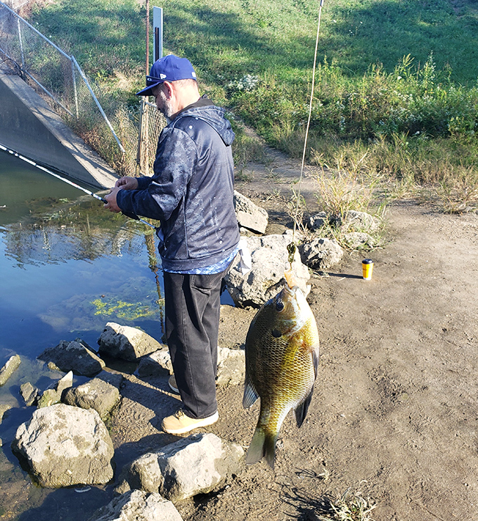 The fisherman's triumphant moment&mdash;proof that the "one that got away" stories sometimes have photographic evidence to back them up.