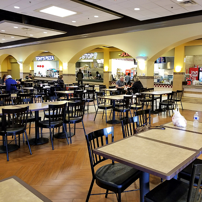 Food court excellence where Tony's Pizza meets mall dining dreams, complete with proper tables and civilized seating arrangements.