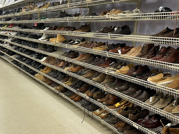 Shoes with stories line these shelves like a footwear library. Each pair has lived a previous life and waits patiently for their next chapter.