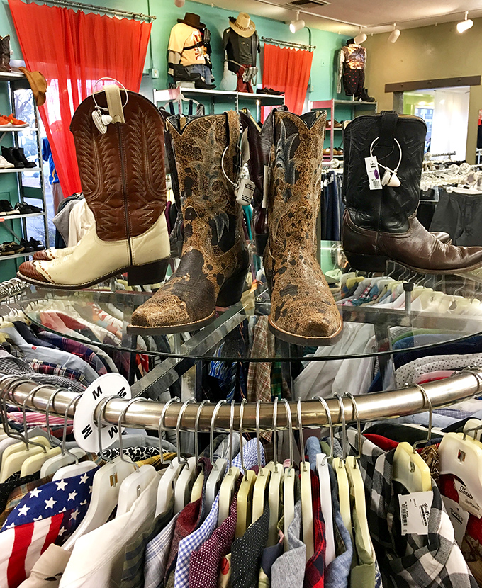 Cowboy boot heaven! These weathered leather storytellers have walked interesting lives before landing on this glass display.