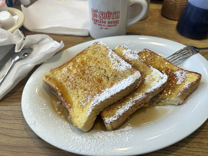 French toast dusted with powdered sugar like fresh snow on a winter morning. The Ol' South mug promises the coffee will be as straightforward as the food.