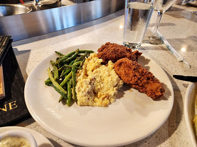 Fried chicken so golden and glorious, it might make you temporarily forget you came for seafood&mdash;that honey drizzle is pure genius.