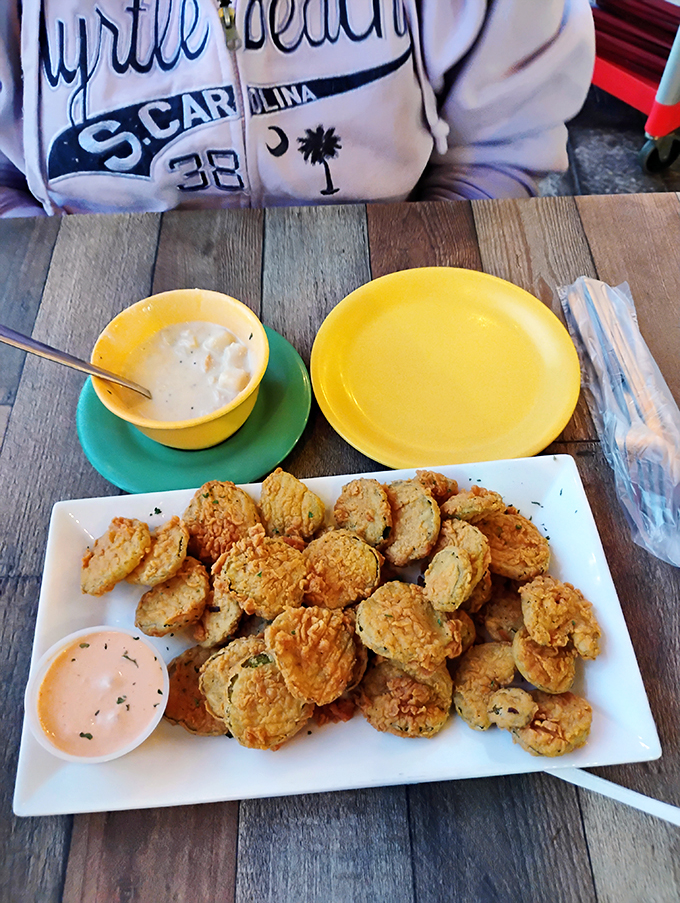 Fried pickles that achieve the impossible balance of tangy, crunchy, and utterly addictive. The dipping sauce is just showing off at this point.