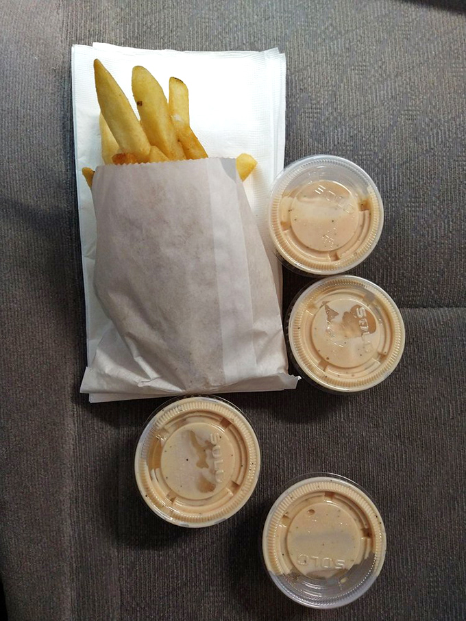 French fries arrive in portions that suggest the kitchen staff genuinely wants you to achieve maximum potato satisfaction.