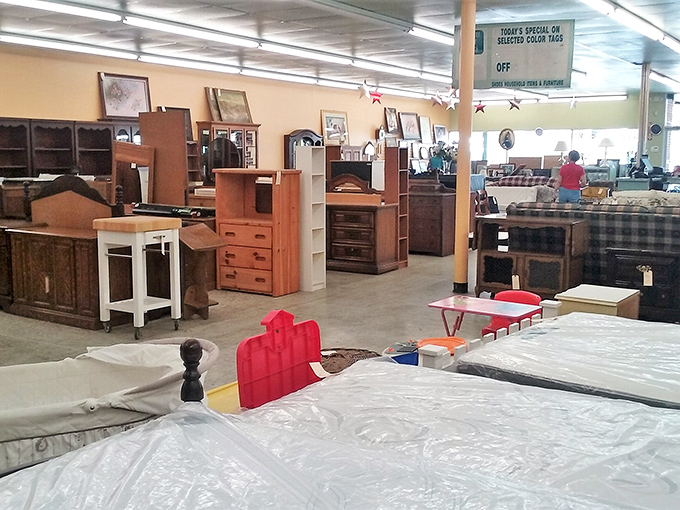 Bedroom furniture galore! That headboard might have witnessed decades of bedtime stories before finding its way here, waiting for a new chapter to begin.