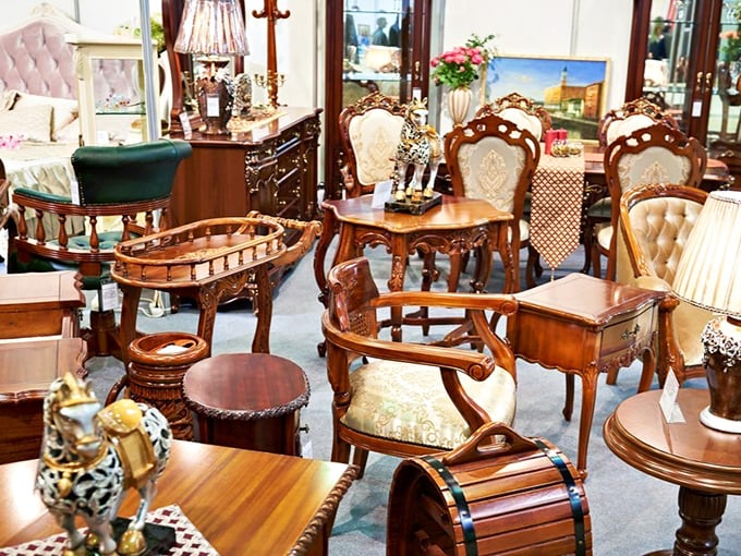 A furniture vignette that whispers tales of dinner parties past. These carved chairs have heard conversations spanning decades of American history.