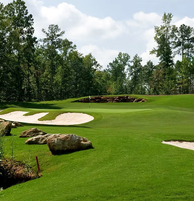 Golf challenges that don't require a passport to Pebble Beach. This beautifully designed hole combines strategic sand traps with Georgia's natural landscape for perfect play.