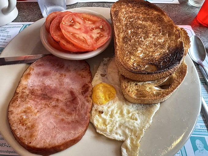 Diner breakfast in its purest form&mdash;thick-cut ham, sunny eggs, and toast waiting to soak up every last bit of yolk-y goodness.