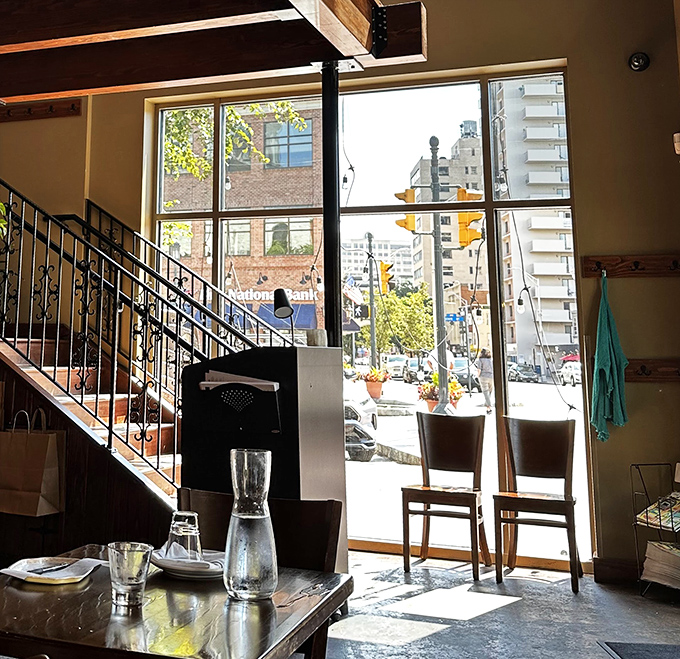 Natural light floods through floor-to-ceiling windows, turning an ordinary lunch into a sun-kissed Italian daydream.