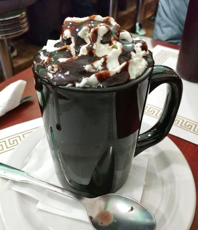 Hot chocolate that doesn't mess around&mdash;topped with a cloud of whipped cream and chocolate drizzle that makes Swiss Miss weep with inadequacy.